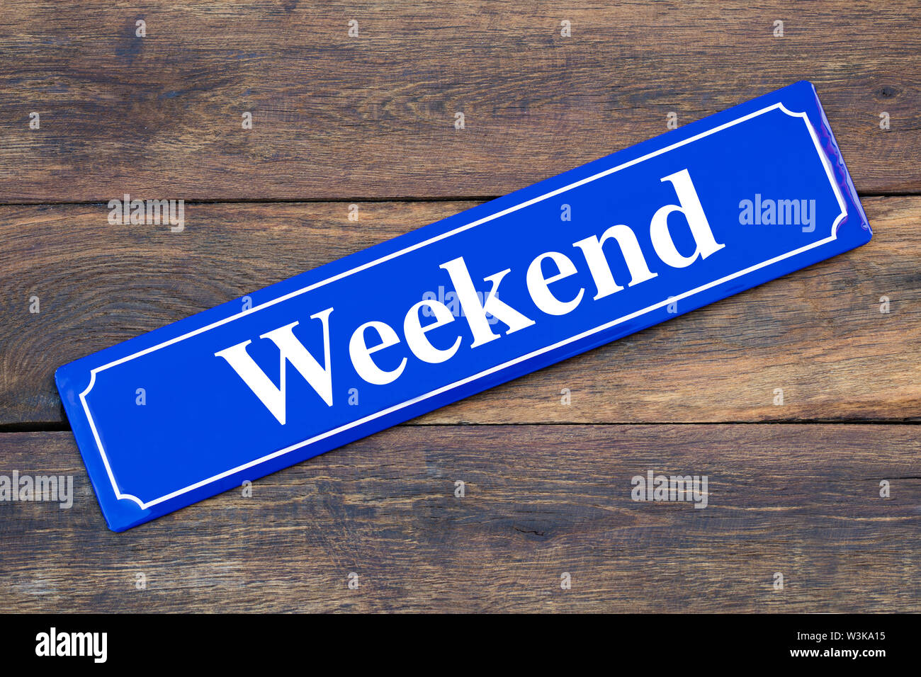 Weekend street sign on wooden background as symbol for relaxing Stock ...
