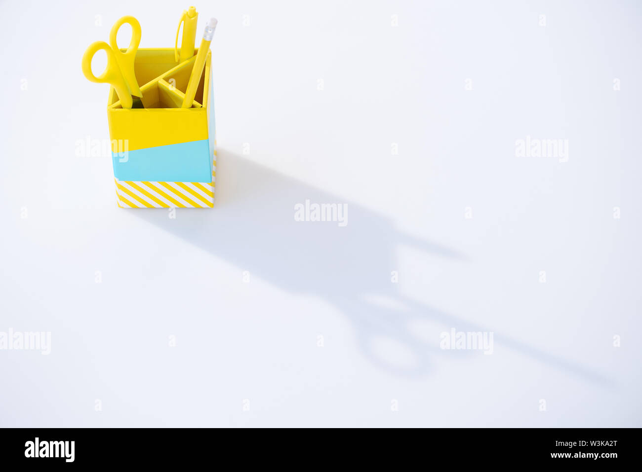 pencil box with scissors, pen and pencil on white background Stock ...