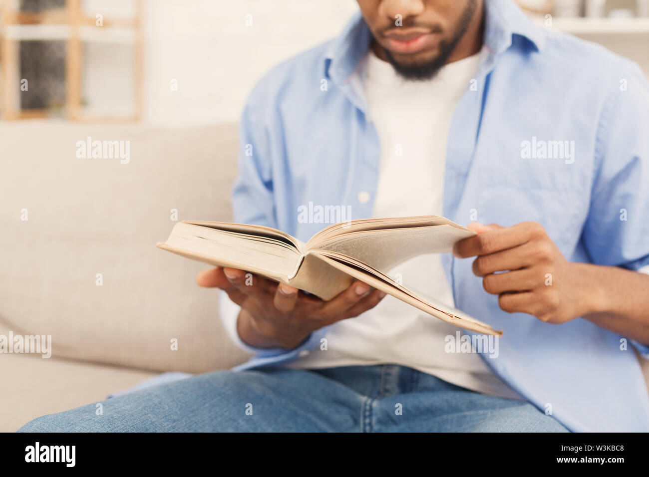 African american man reading book hi-res stock photography and images ...