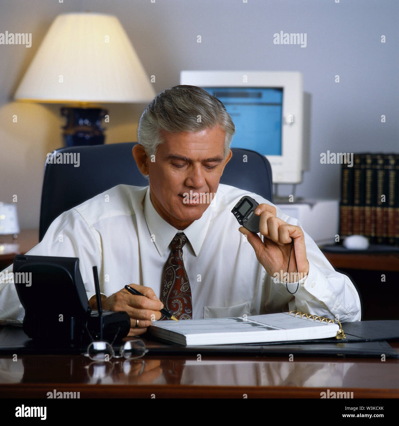 Business man dictating Stock Photo - Alamy