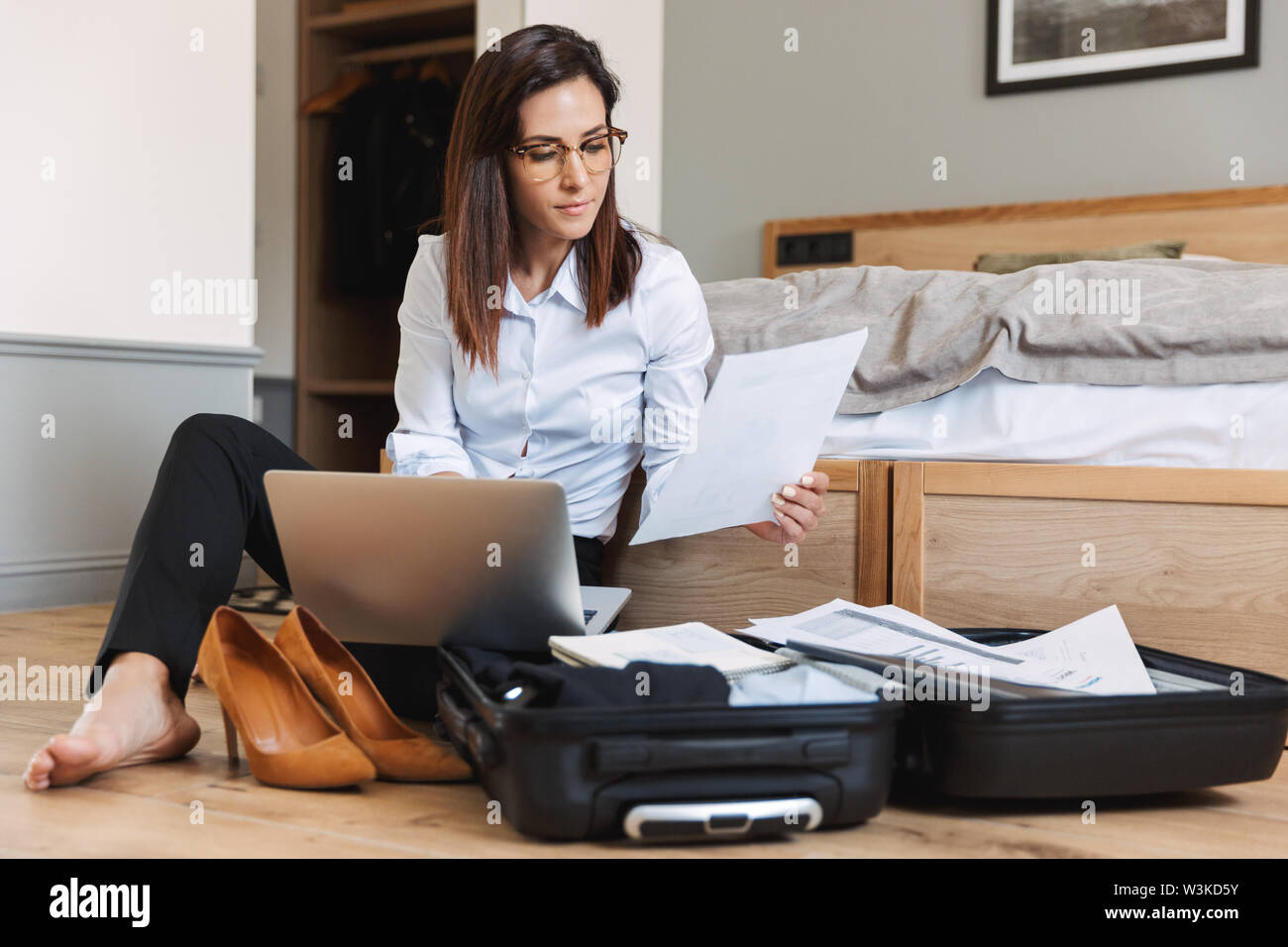 Portrait of confident adult businesswoman in formal suit working with ...