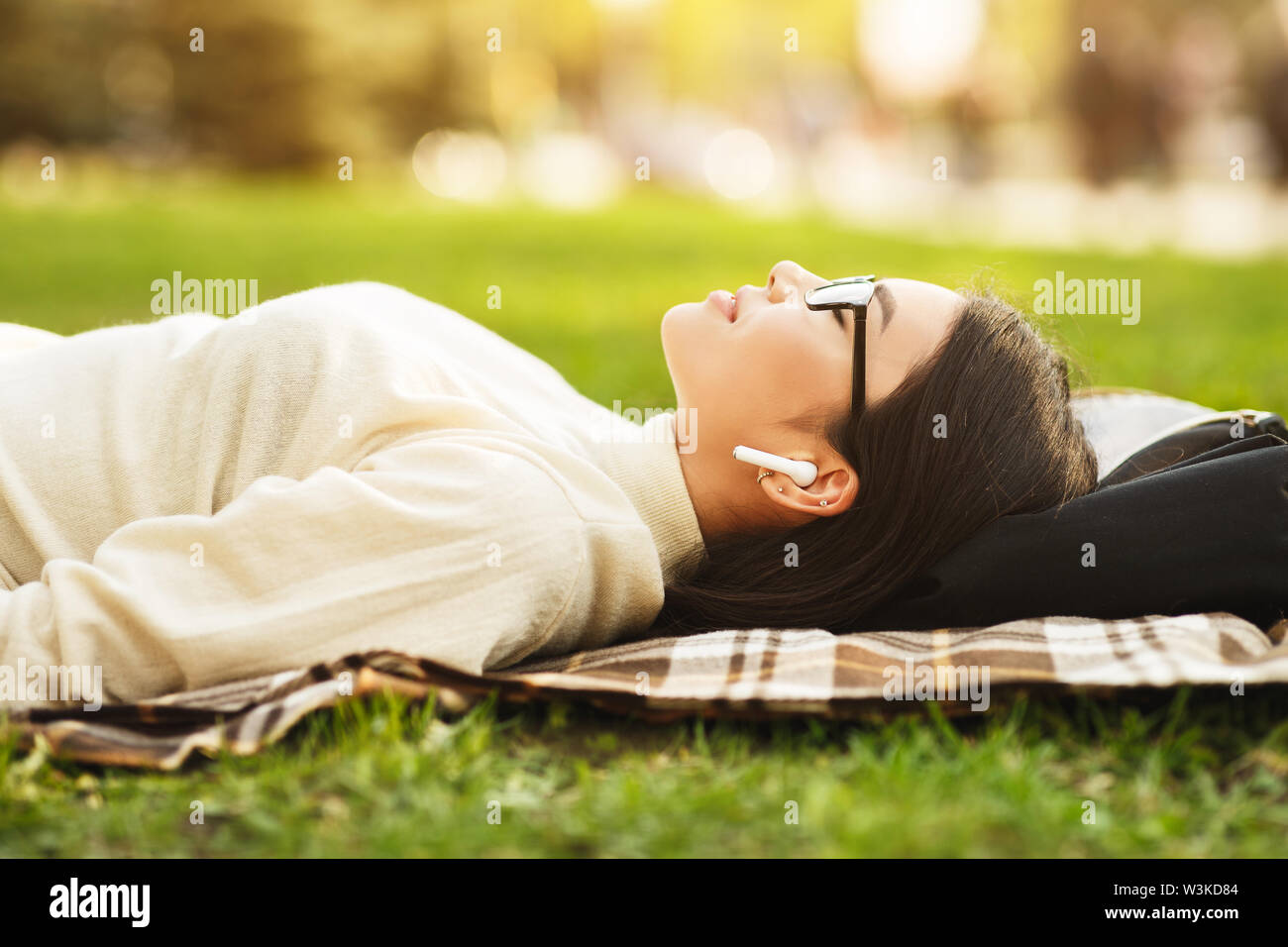 Student girl listening music with closed eyes Stock Photo - Alamy