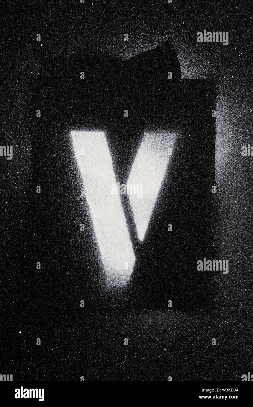 Letter V grunge spray paninted stencil font Stock Photo - Alamy