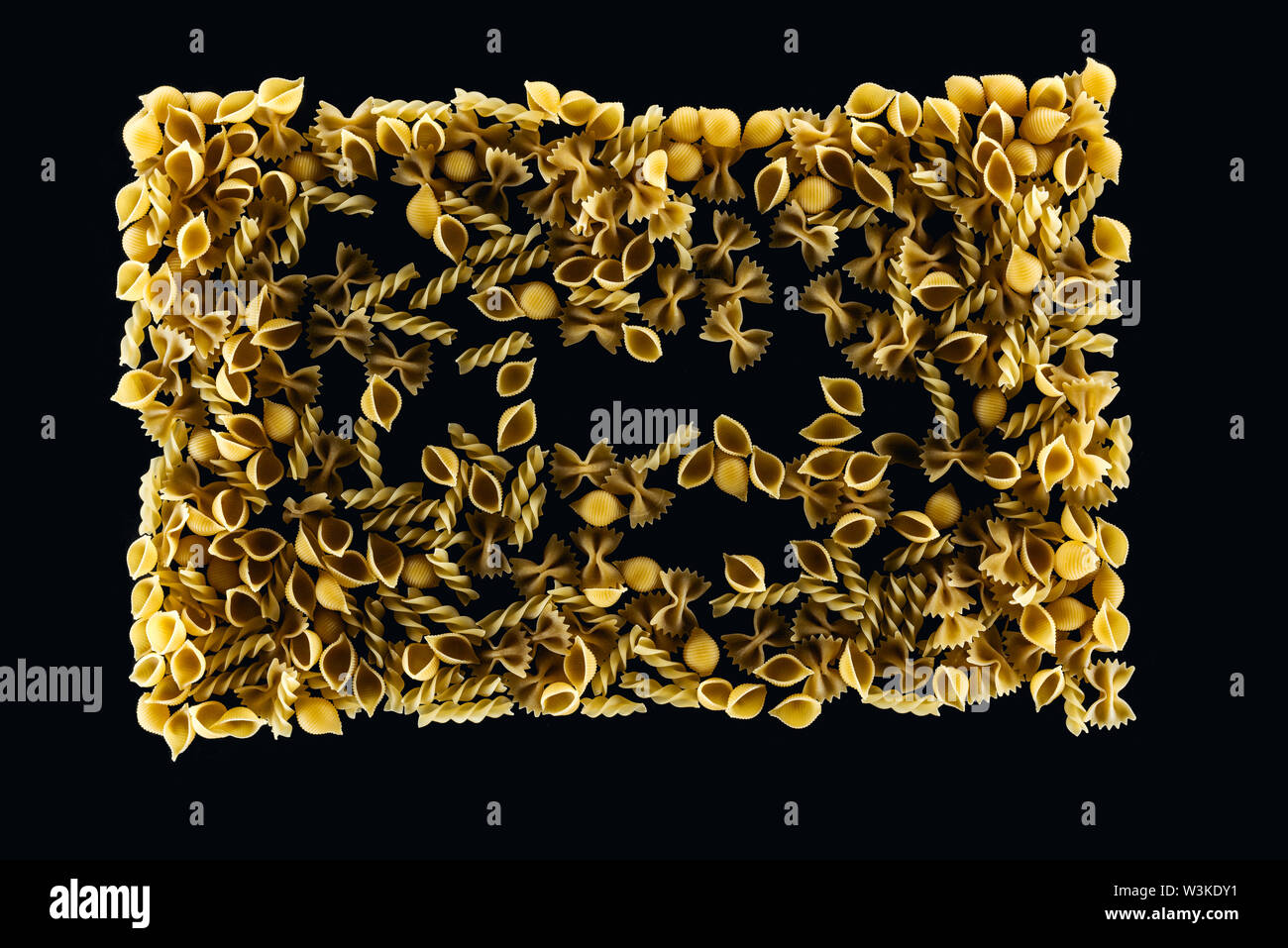 top view of uncooked pasta in rectangle form isolated on black Stock ...