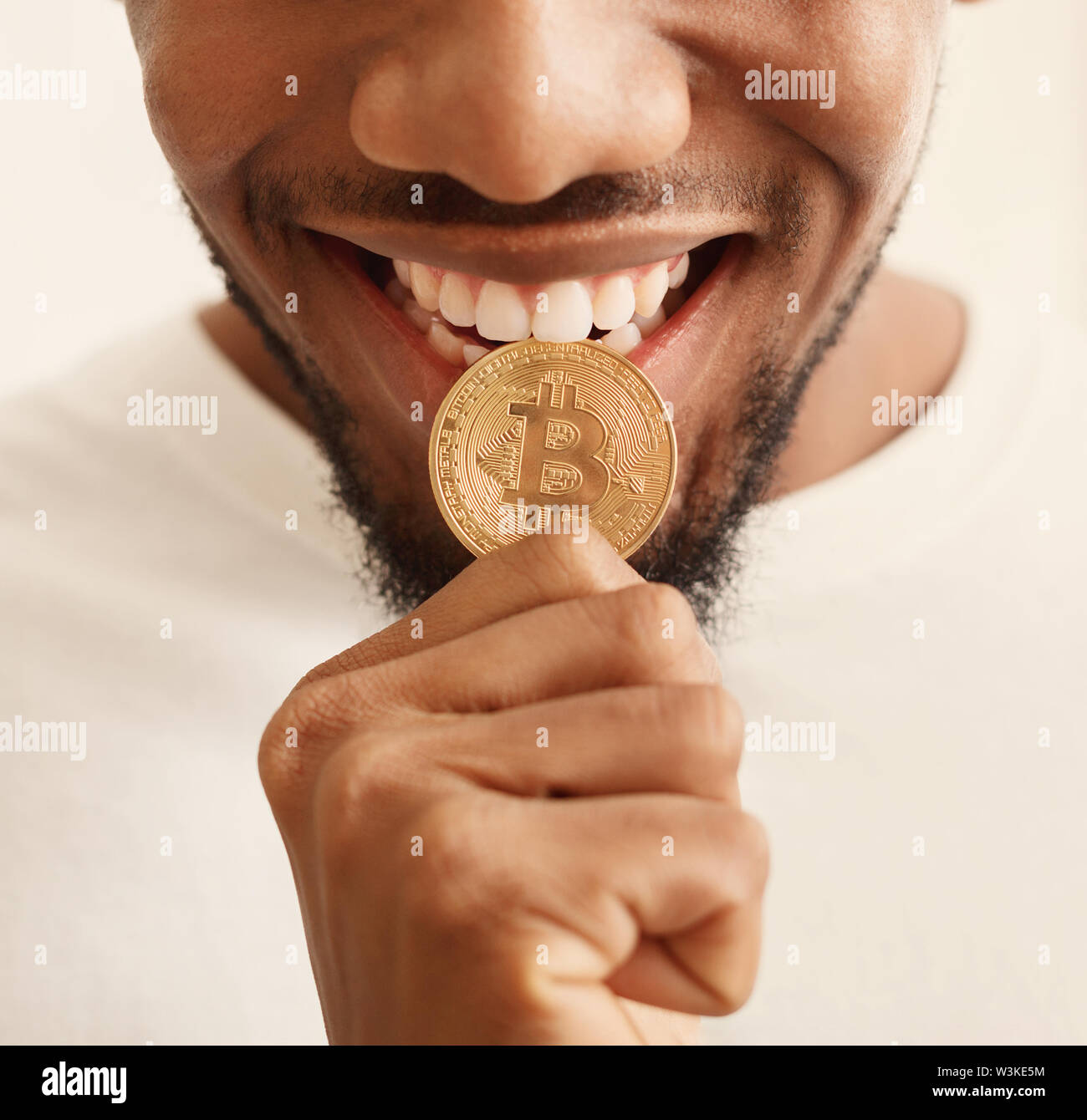 Biting Gold Coin High Resolution Stock Photography and Images - Alamy