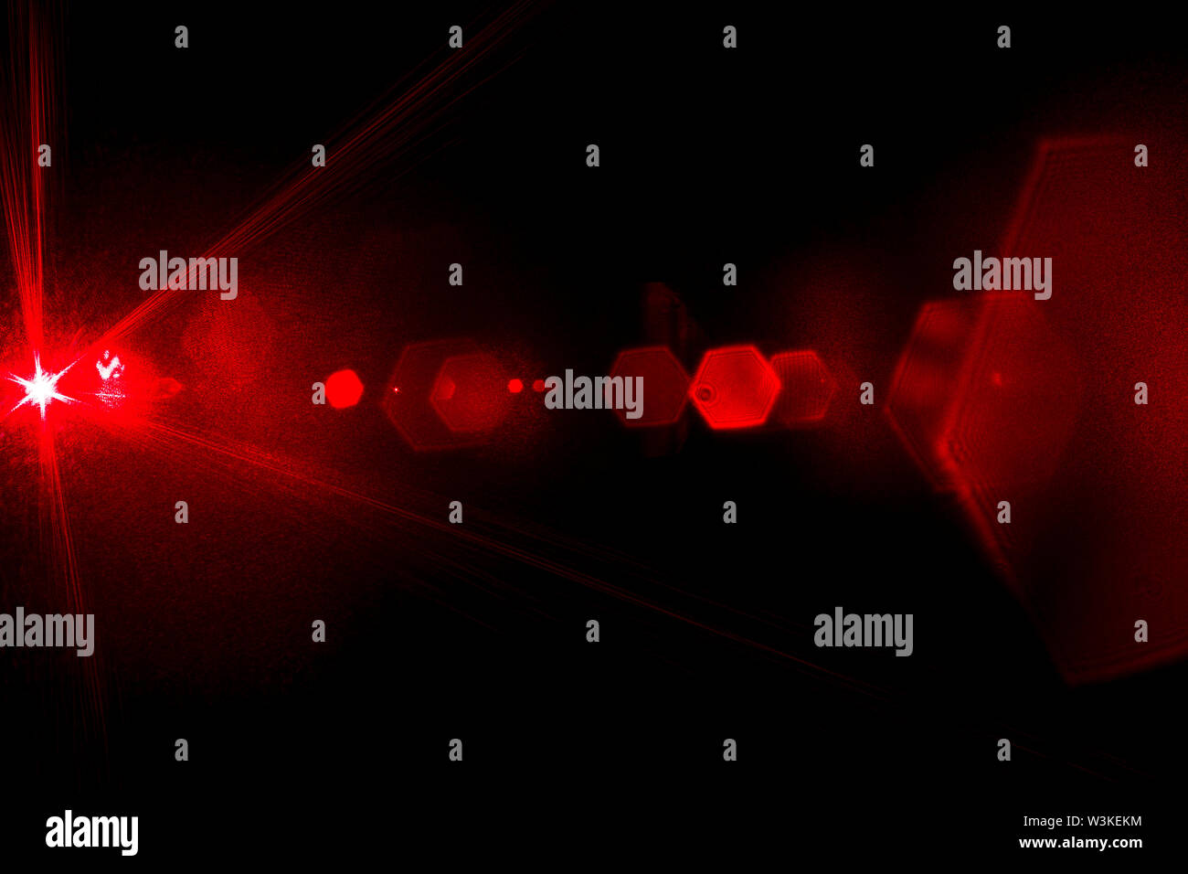 Camera lens flare by laser light create hexagons of objective iris ...