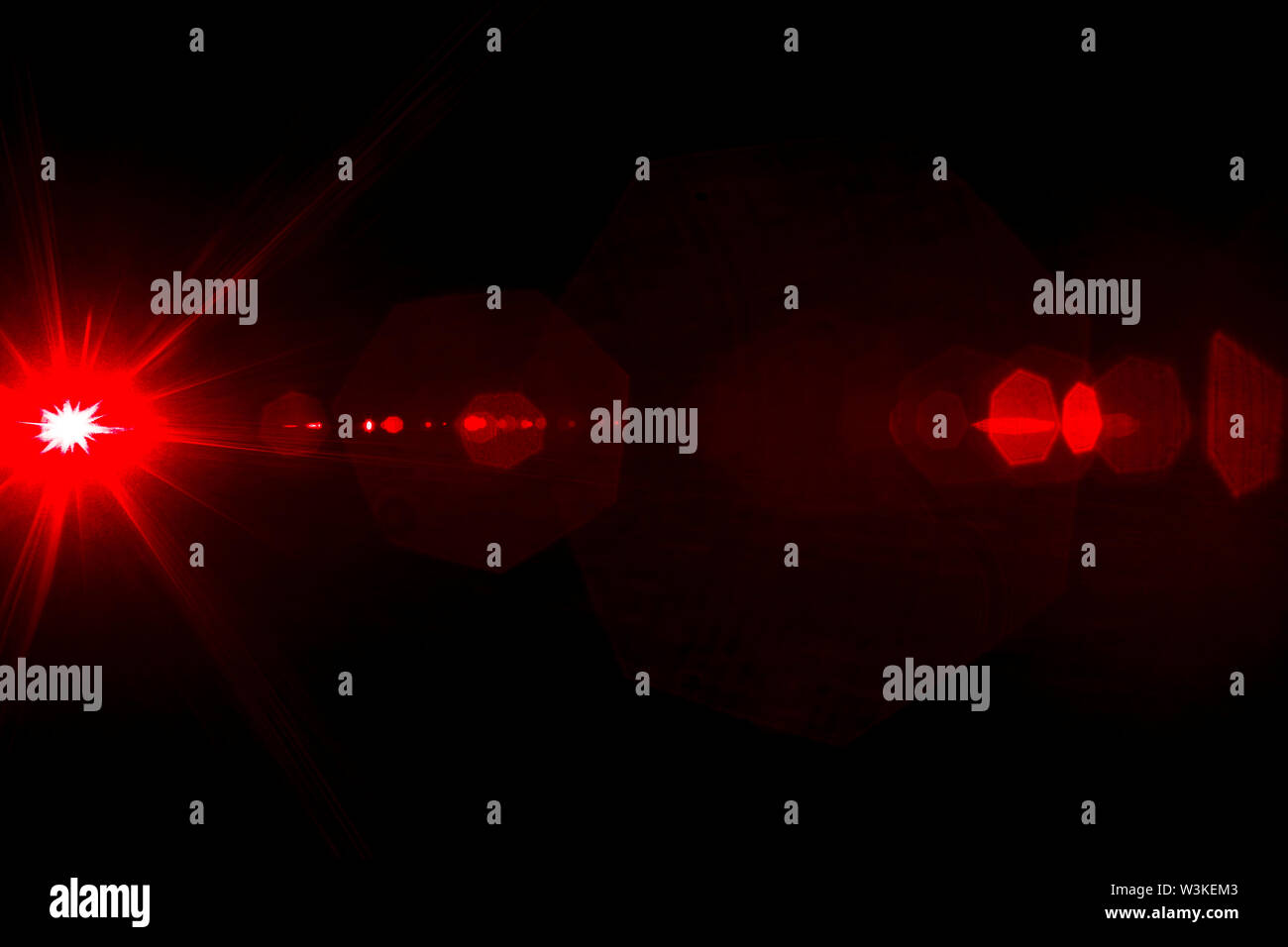 Camera lens flare by laser light create hexagons of objective iris ...
