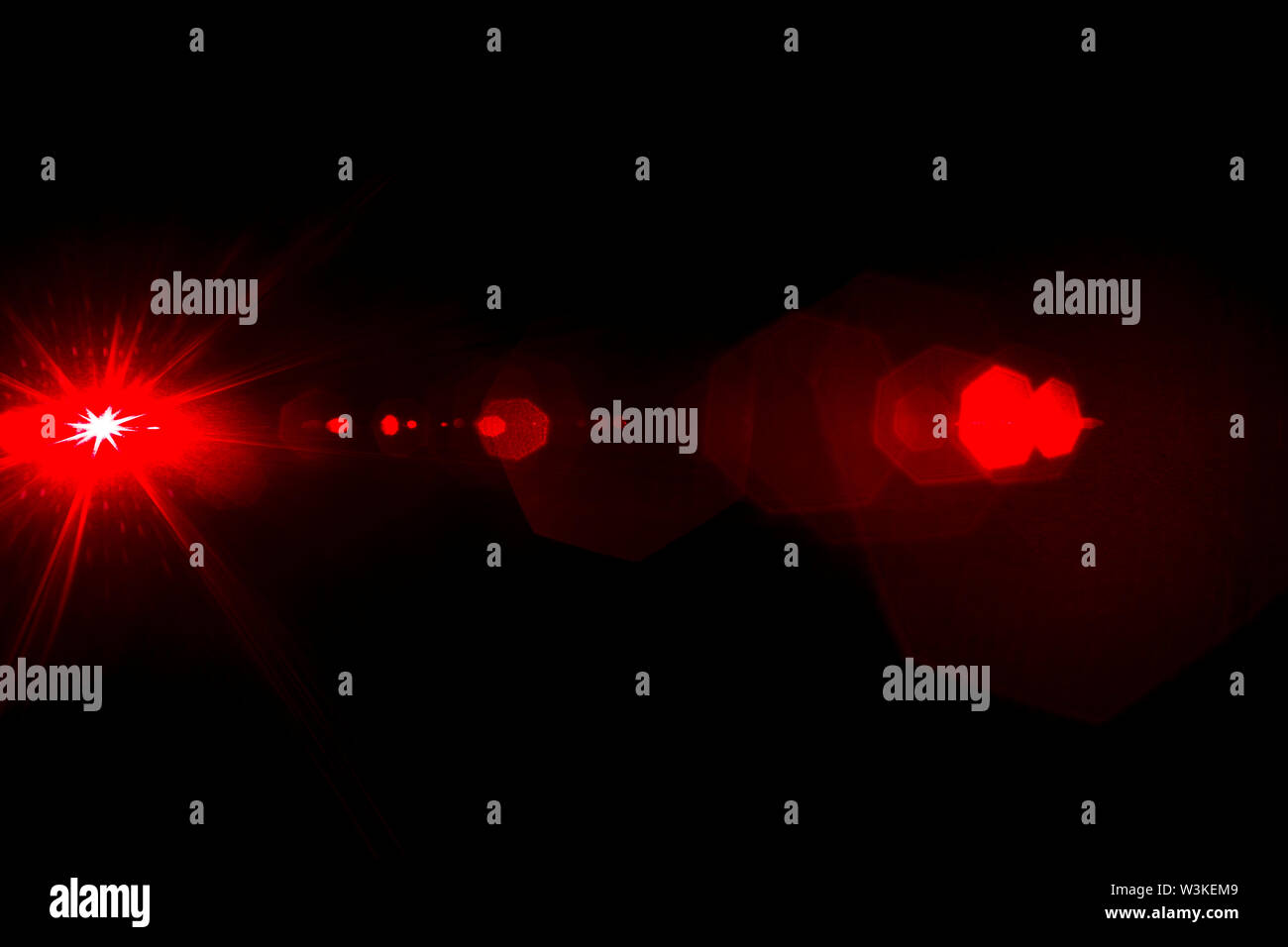 Camera lens flare by laser light create hexagons of objective iris ...