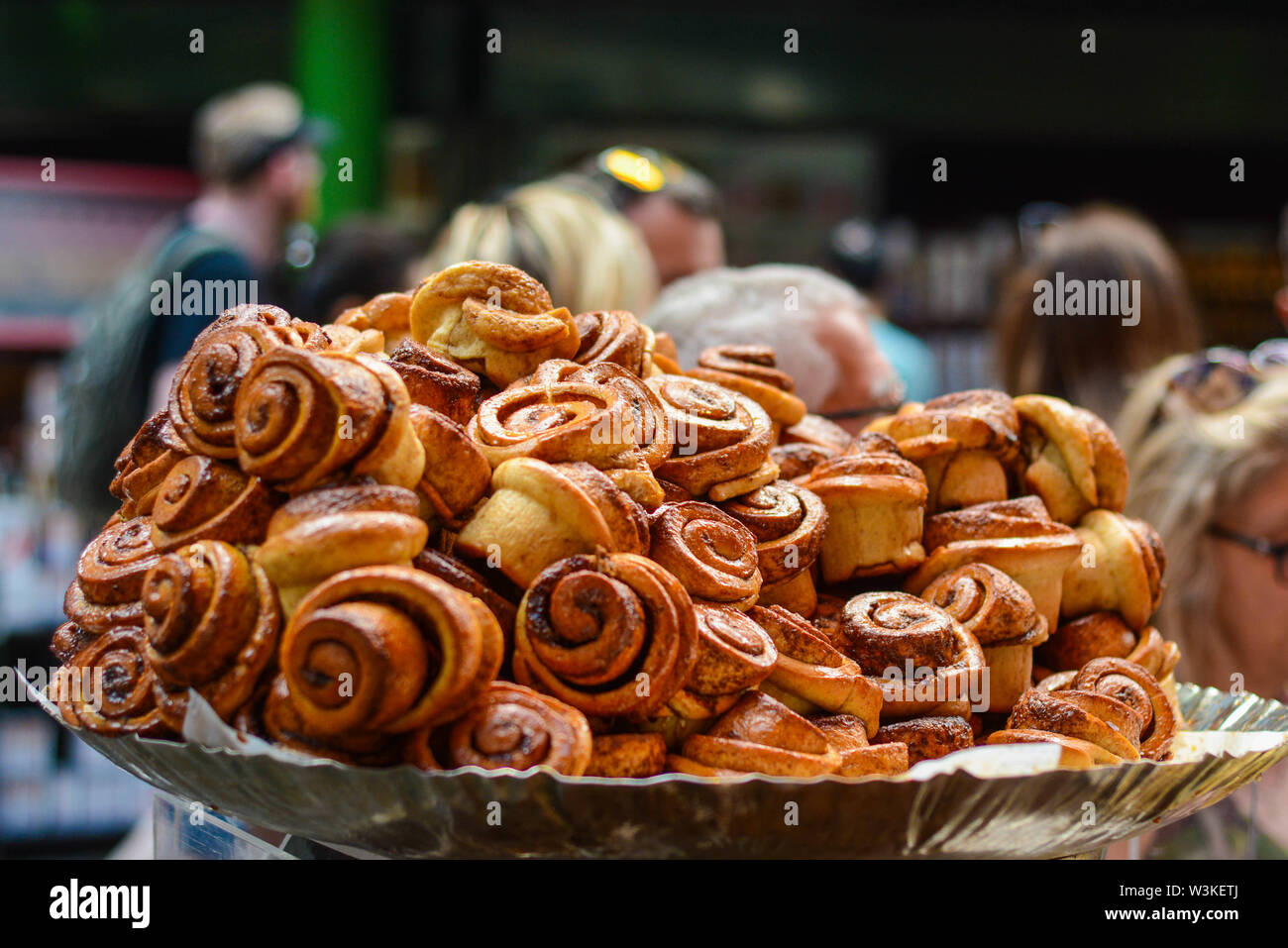 Variety of pastry. Cinnamon rolls on display at the Borough Market ...