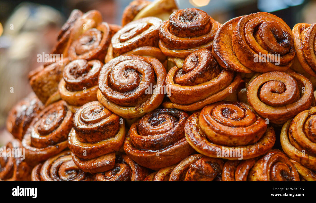 Variety of pastry. Cinnamon rolls on display at the Borough Market ...