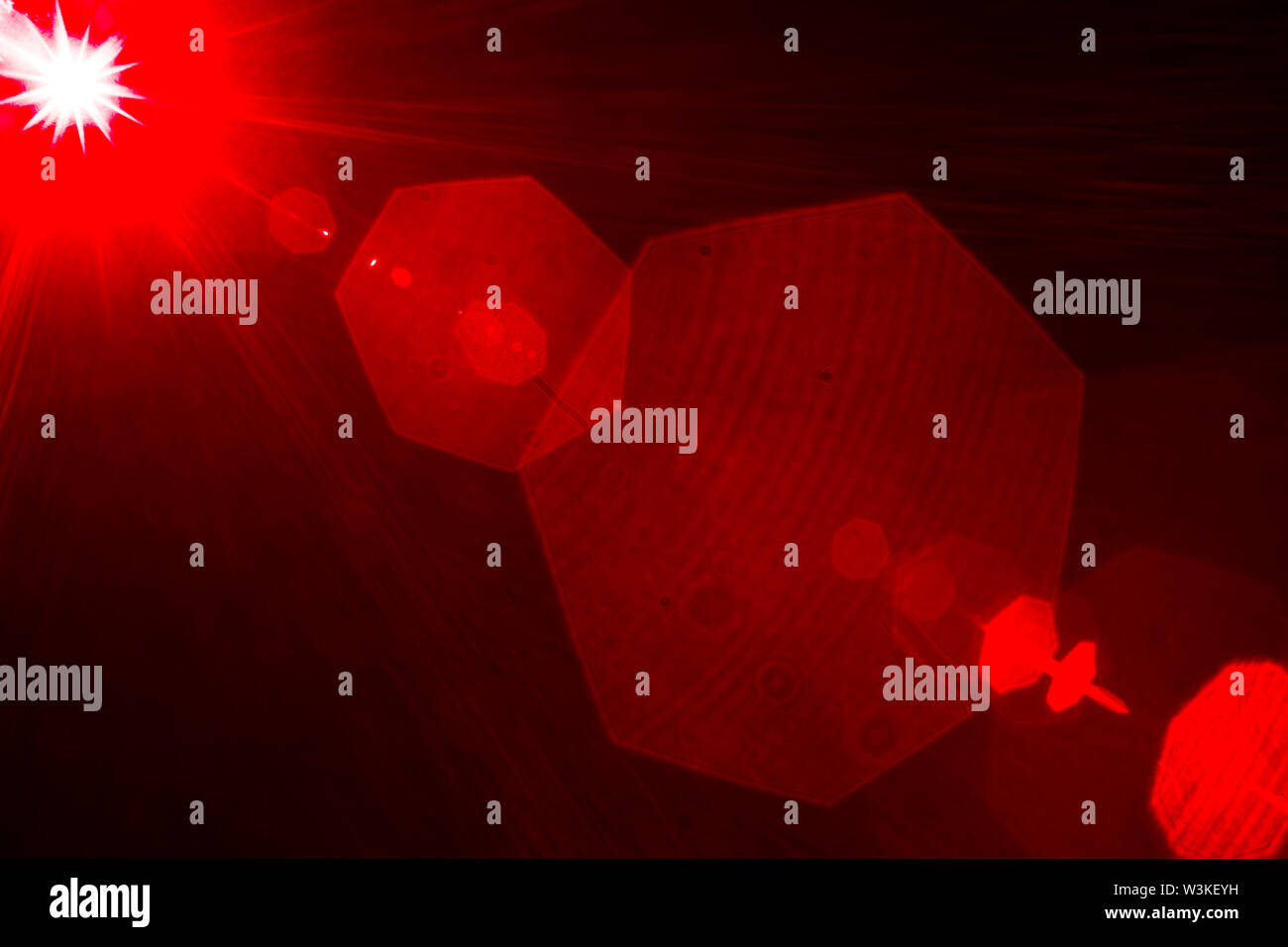 Camera lens flare by laser light create hexagons of objective iris ...
