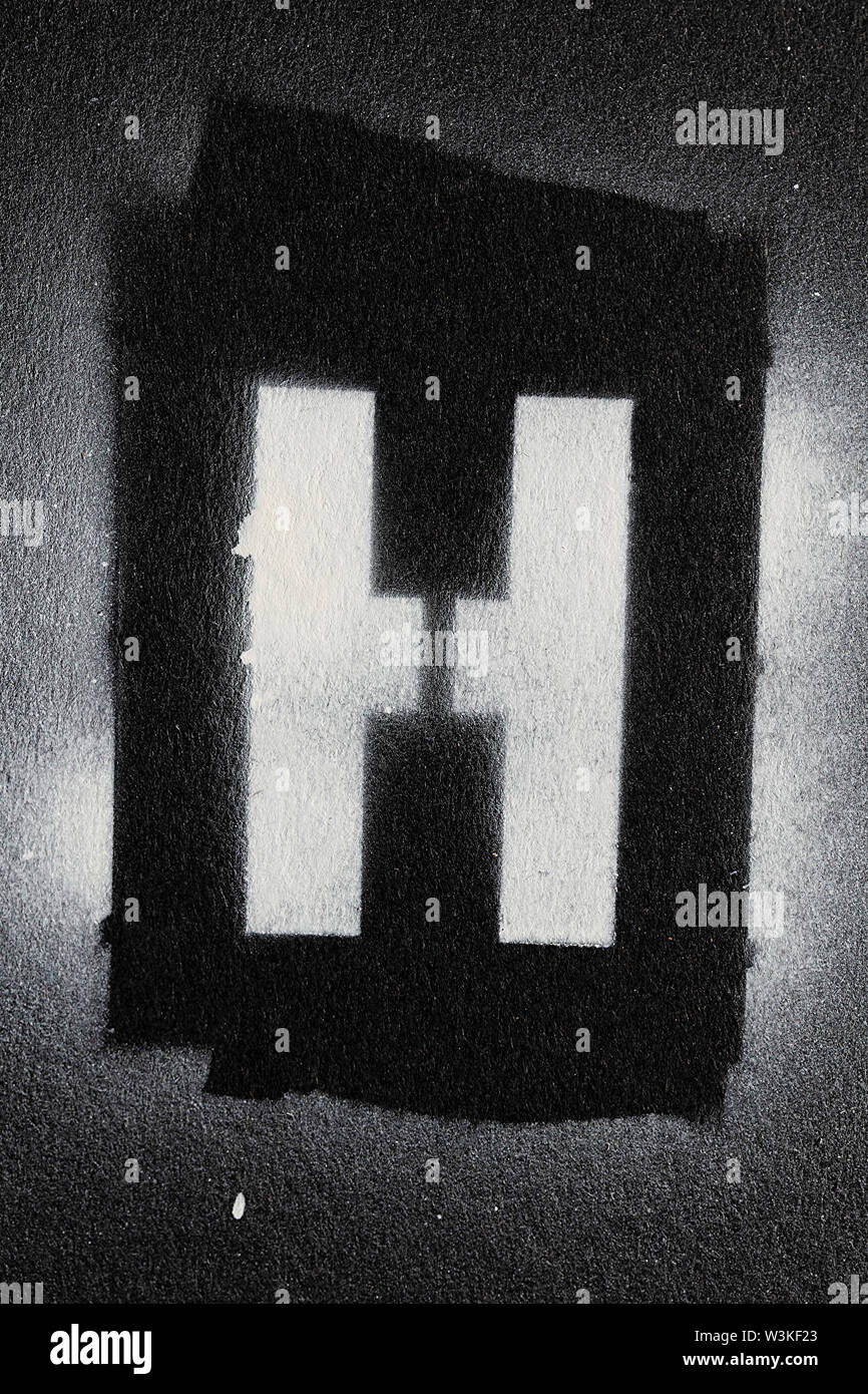 Letter H grunge spray paninted stencil font Stock Photo - Alamy