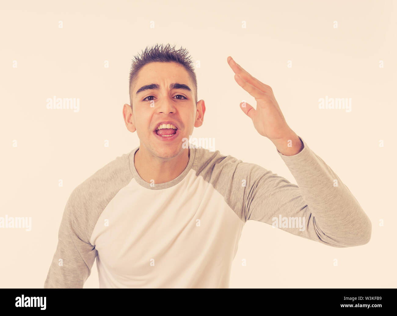 Portrait of angry and upset young man looking furious, aggressive and ...