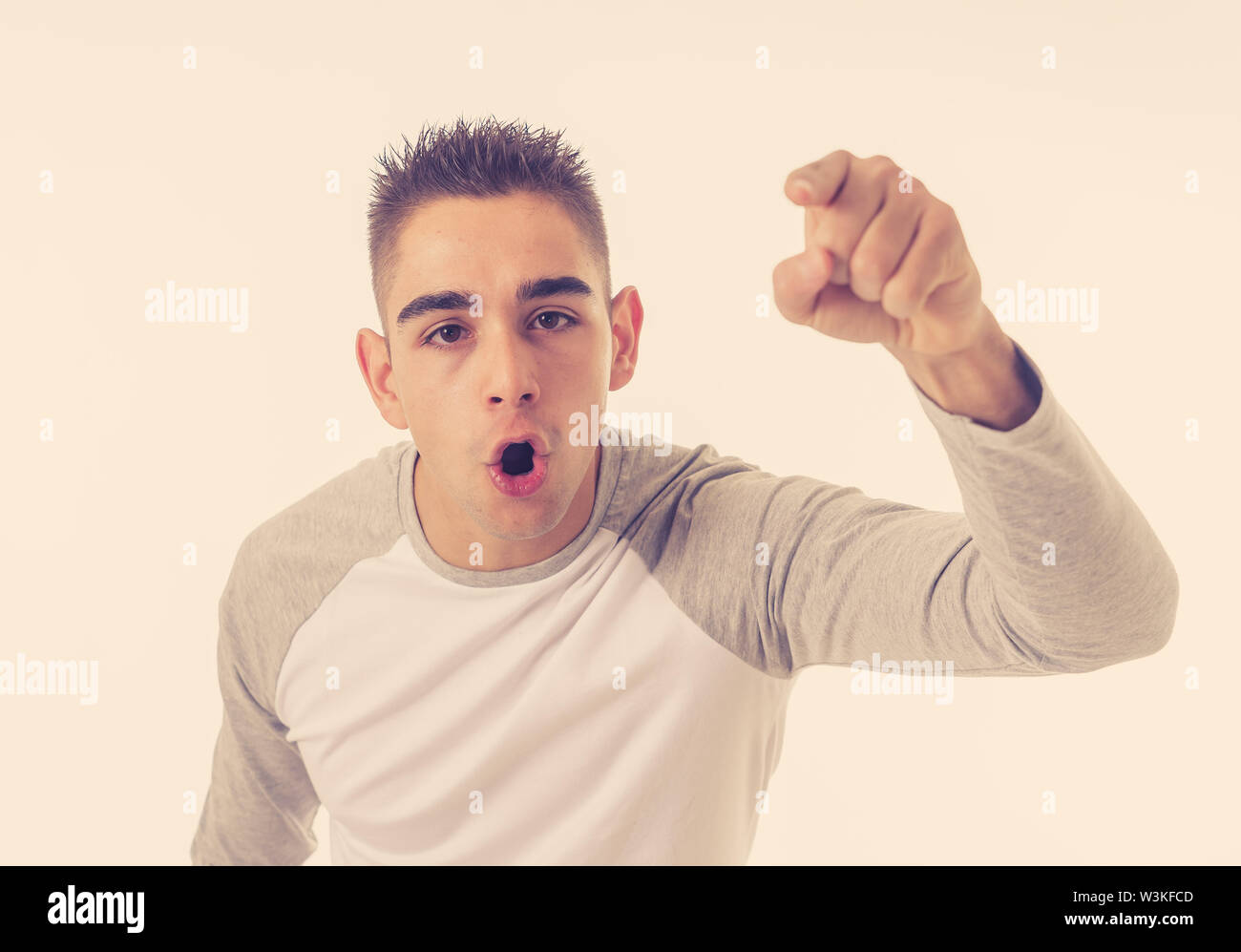 Portrait of angry and upset young man looking furious, aggressive and ...