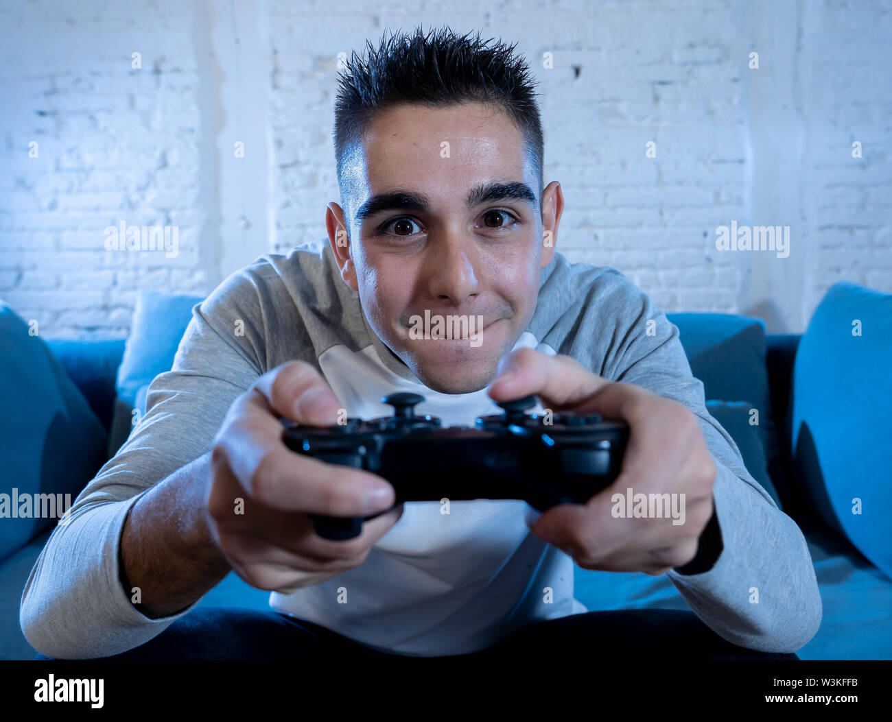 Portrait of young student man playing video games having fun winning ...