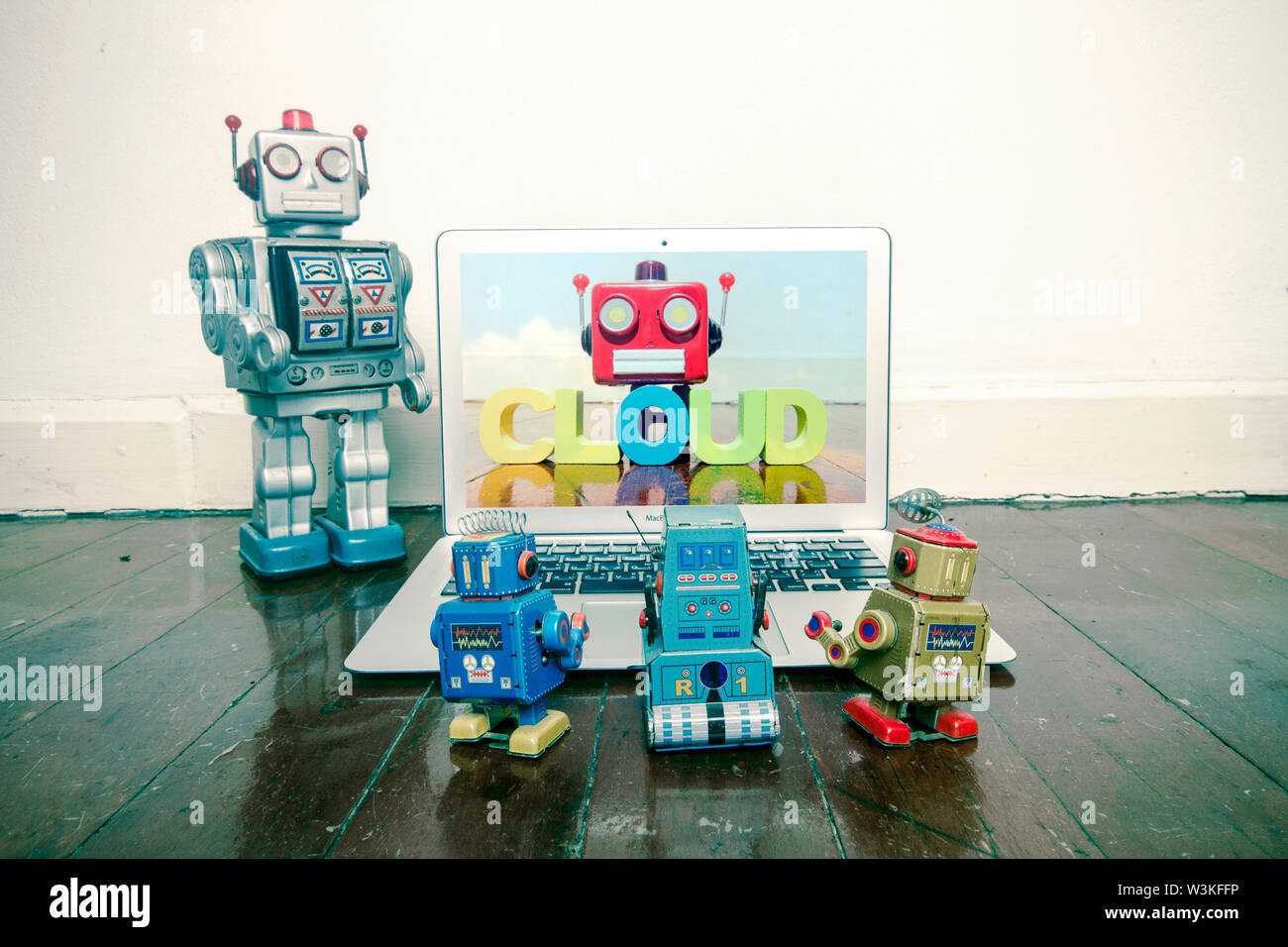 kid robots learn about cloud computing on a laptop Stock Photo - Alamy