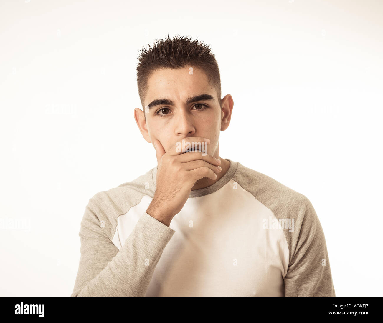 Portrait of young man in shock with scared face making frightened ...