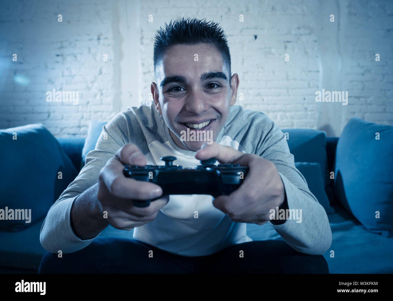 Portrait of young student man playing video games having fun winning ...