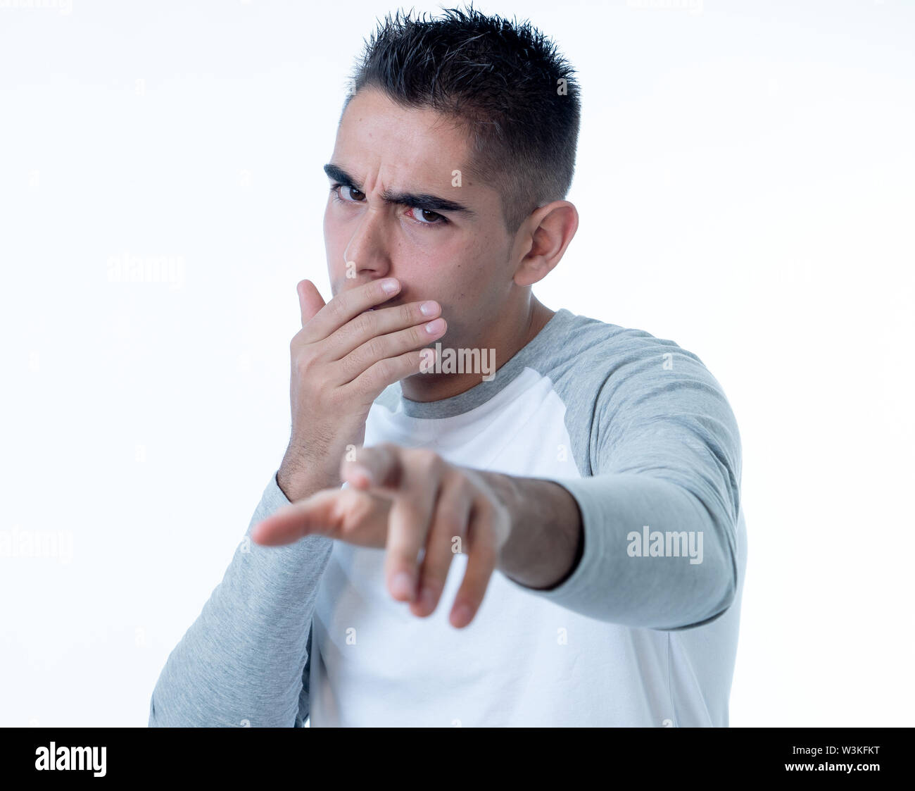 Portrait of young man in shock with scared face making frightened ...