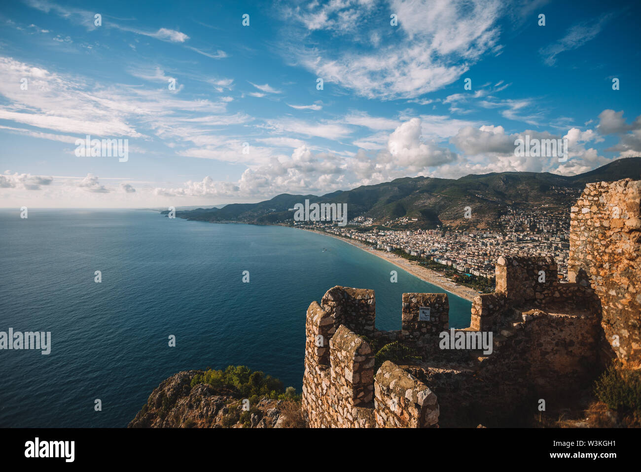 Alanya sea shore with old castle walls above beautiful blue sea, Turkey ...