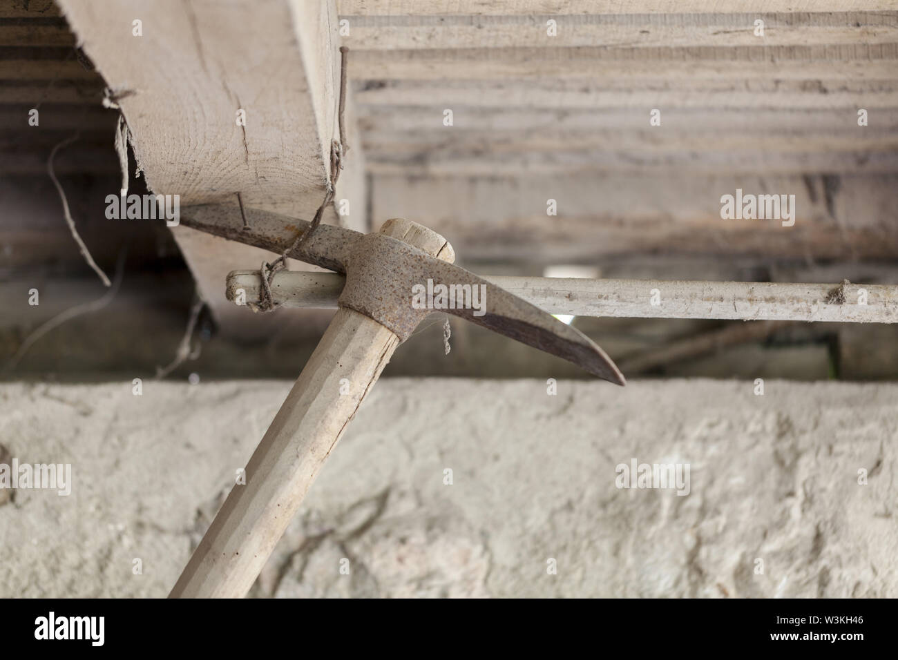 old iron pickaxe hanging on top Stock Photo - Alamy
