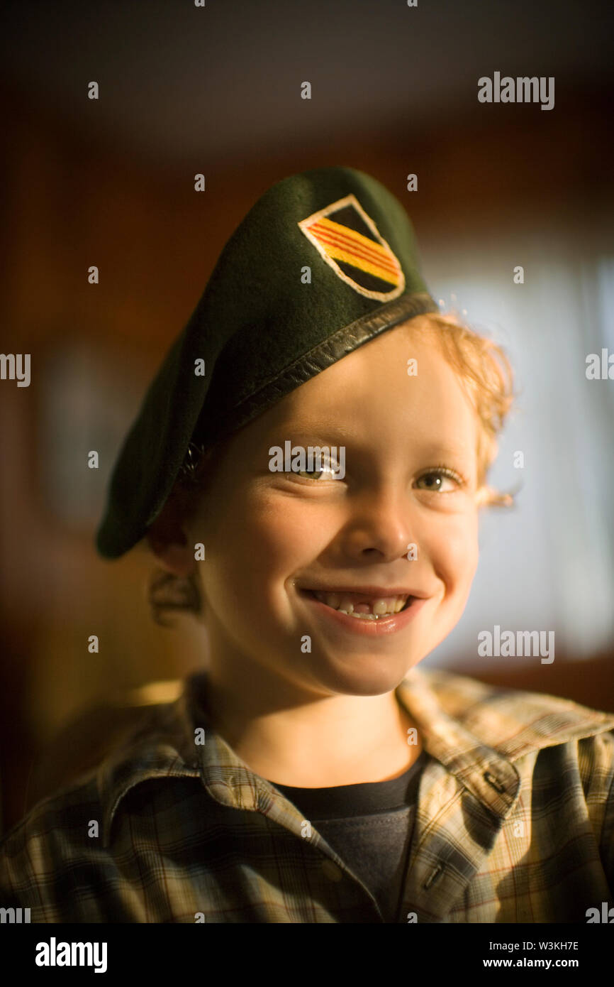 Portrait of a smiling young boy wearing a beret Stock Photo - Alamy