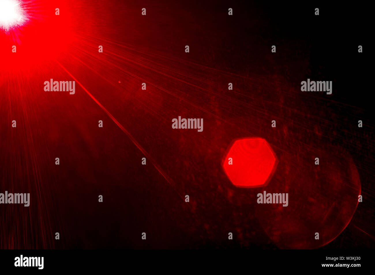 Camera lens flare by laser light create hexagons of objective iris ...