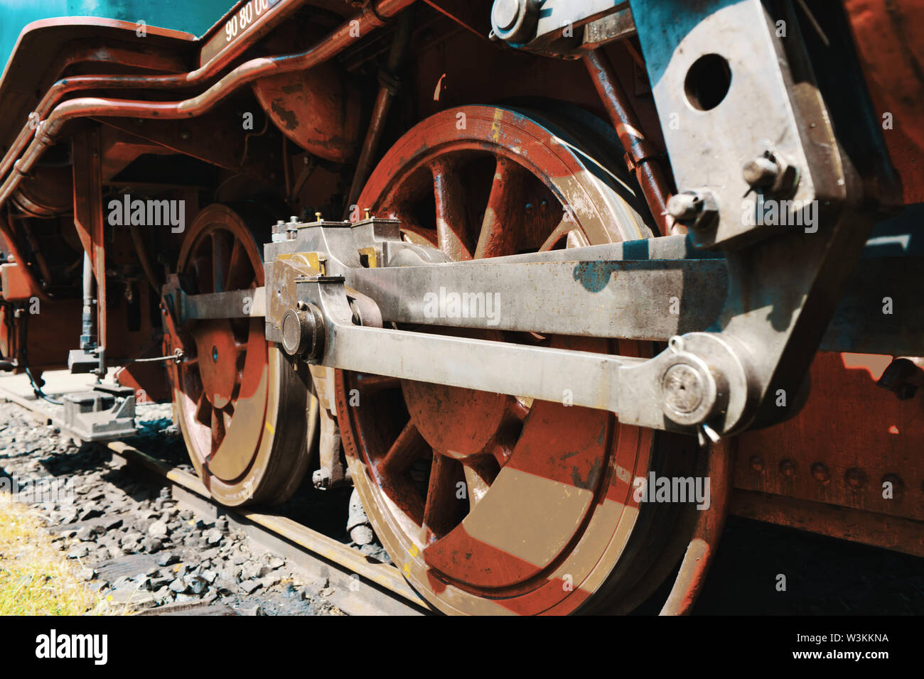 Close-up of the drive wheels and the drive rod of a historic steam ...