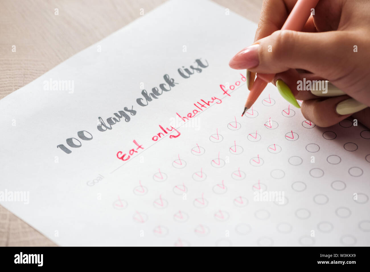 Woman writing check list hi-res stock photography and images - Alamy