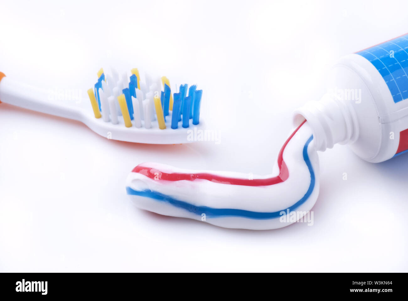 toothbrush with toothpaste tube in closeup on white background Stock ...