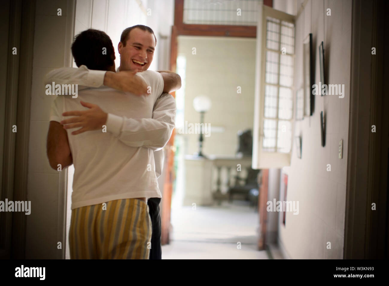 View of two men greeting each other Stock Photo - Alamy