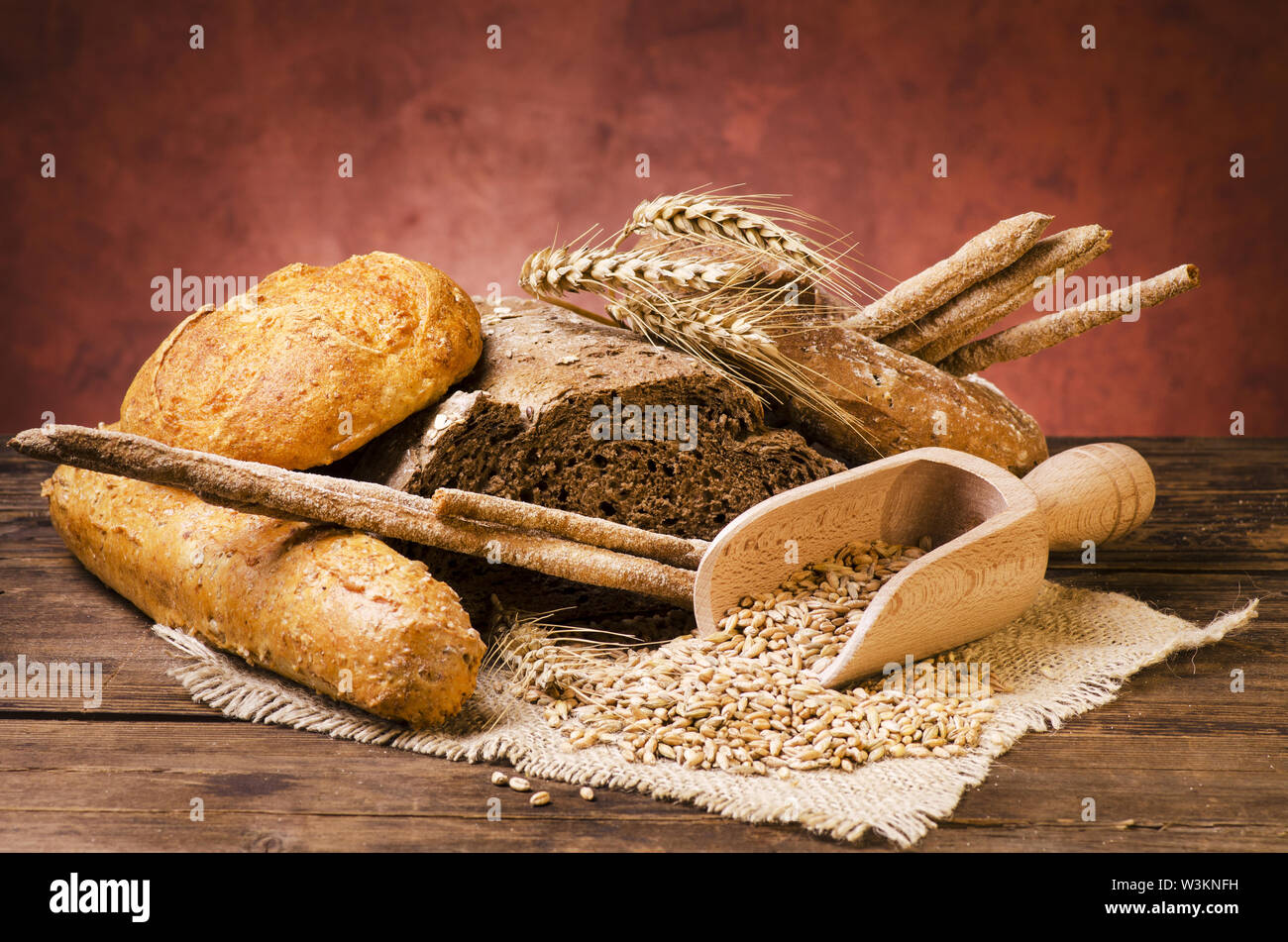 still life, a wide assortment of bread of different types and shapes on ...