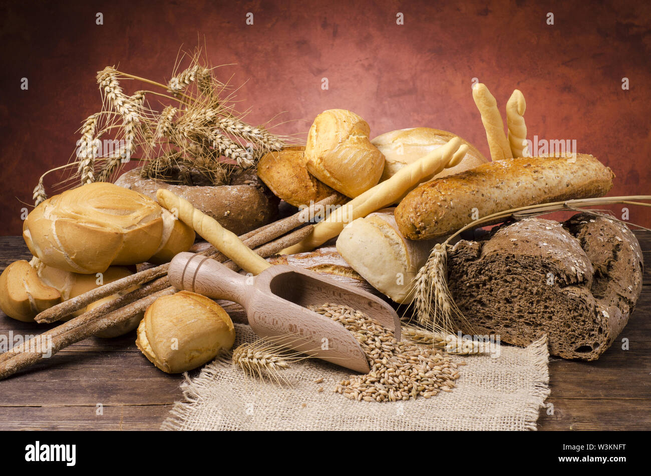 still life, a wide assortment of bread of different types and shapes on ...