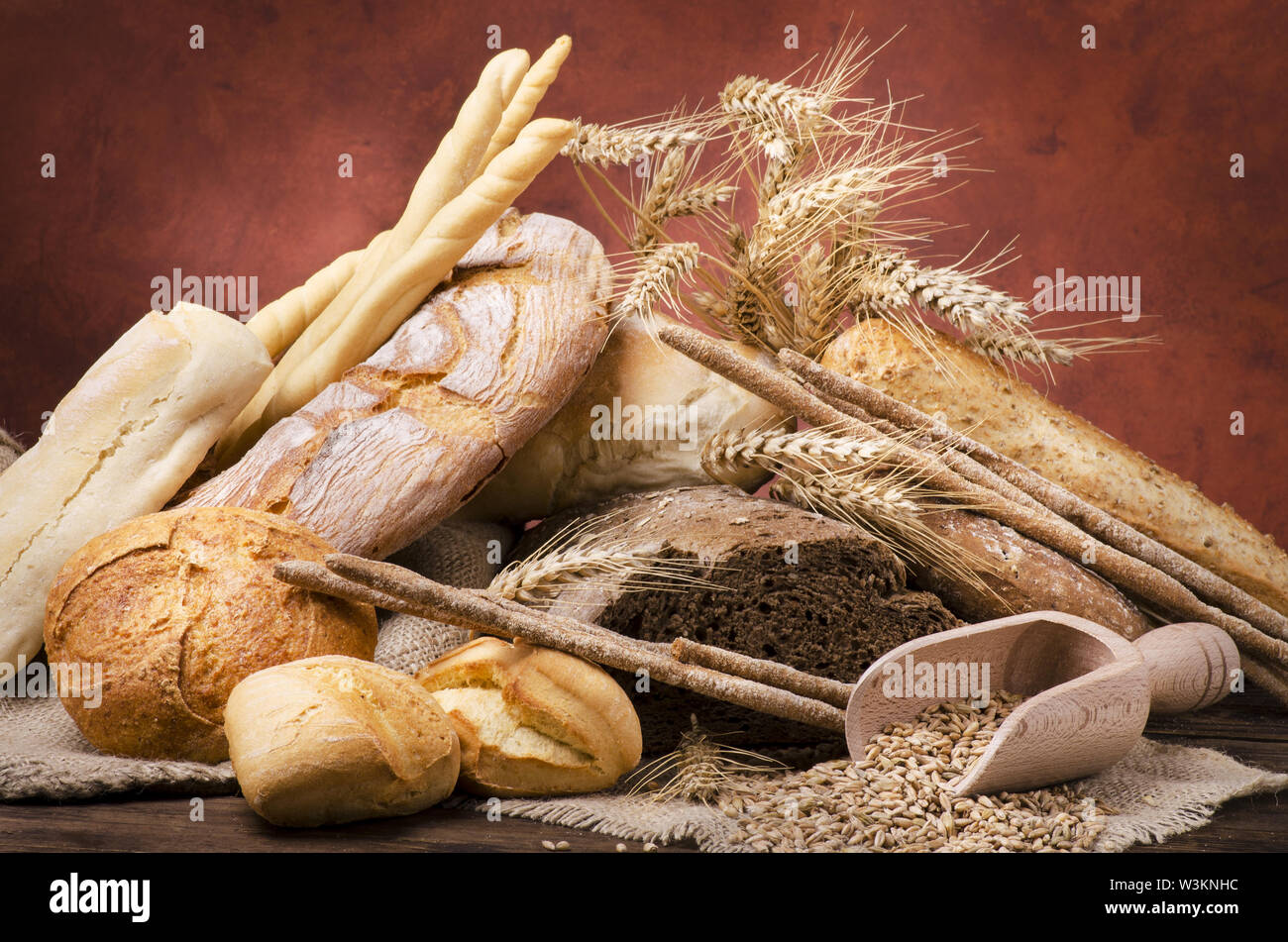 still life, a wide assortment of bread of different types and shapes on ...