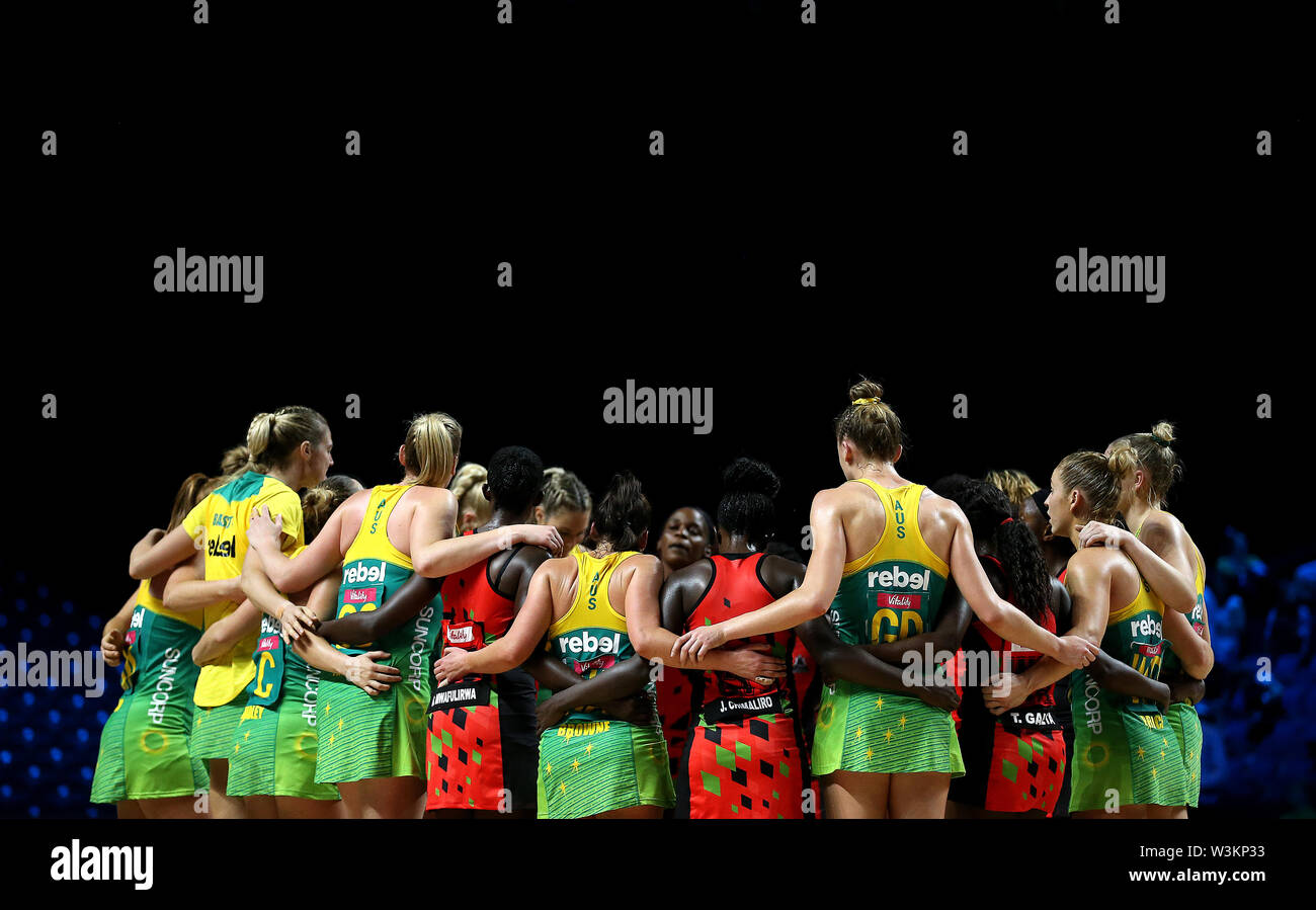 Both teams huddle after the final whistle during the Netball World Cup ...