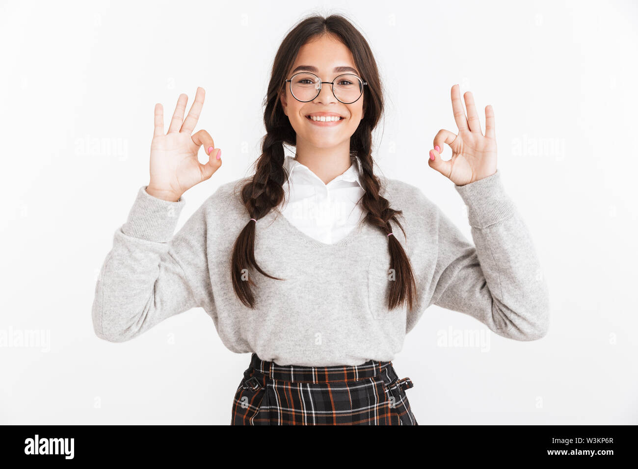Photo closeup of beautiful teenage girl wearing eyeglasses and school ...