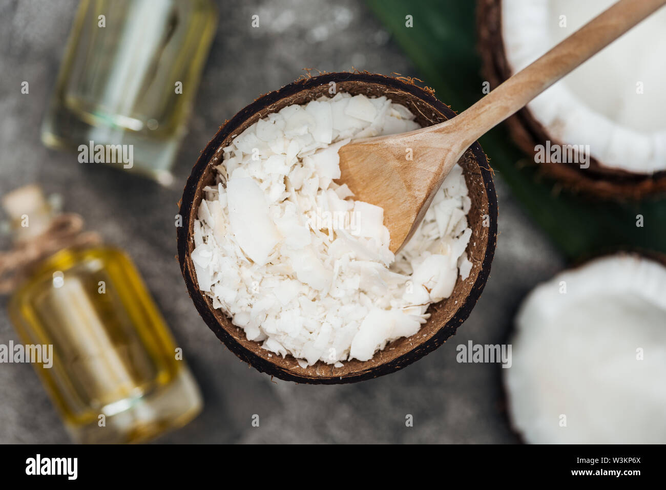 top view of coconut shavings with wooden spoon in coconut shell Stock ...