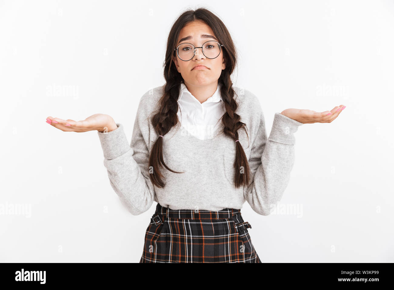 Photo closeup of perplexed teenage girl wearing eyeglasses and school ...