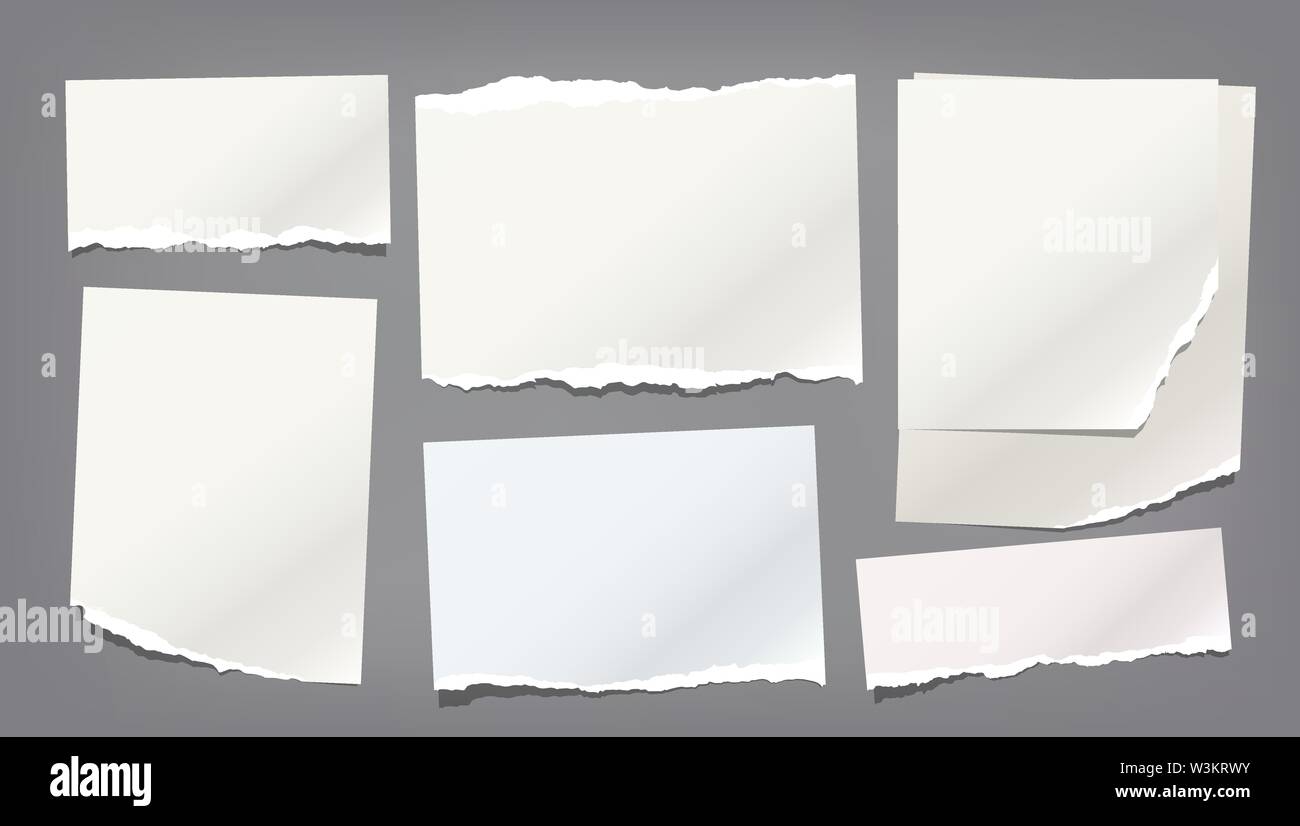 Ripped, torn note, notebook paper strips, copybook sheet stuck on dark ...