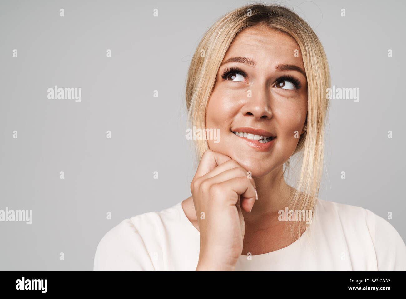 Image of a beautiful thinking dreaming young amazing blonde woman ...