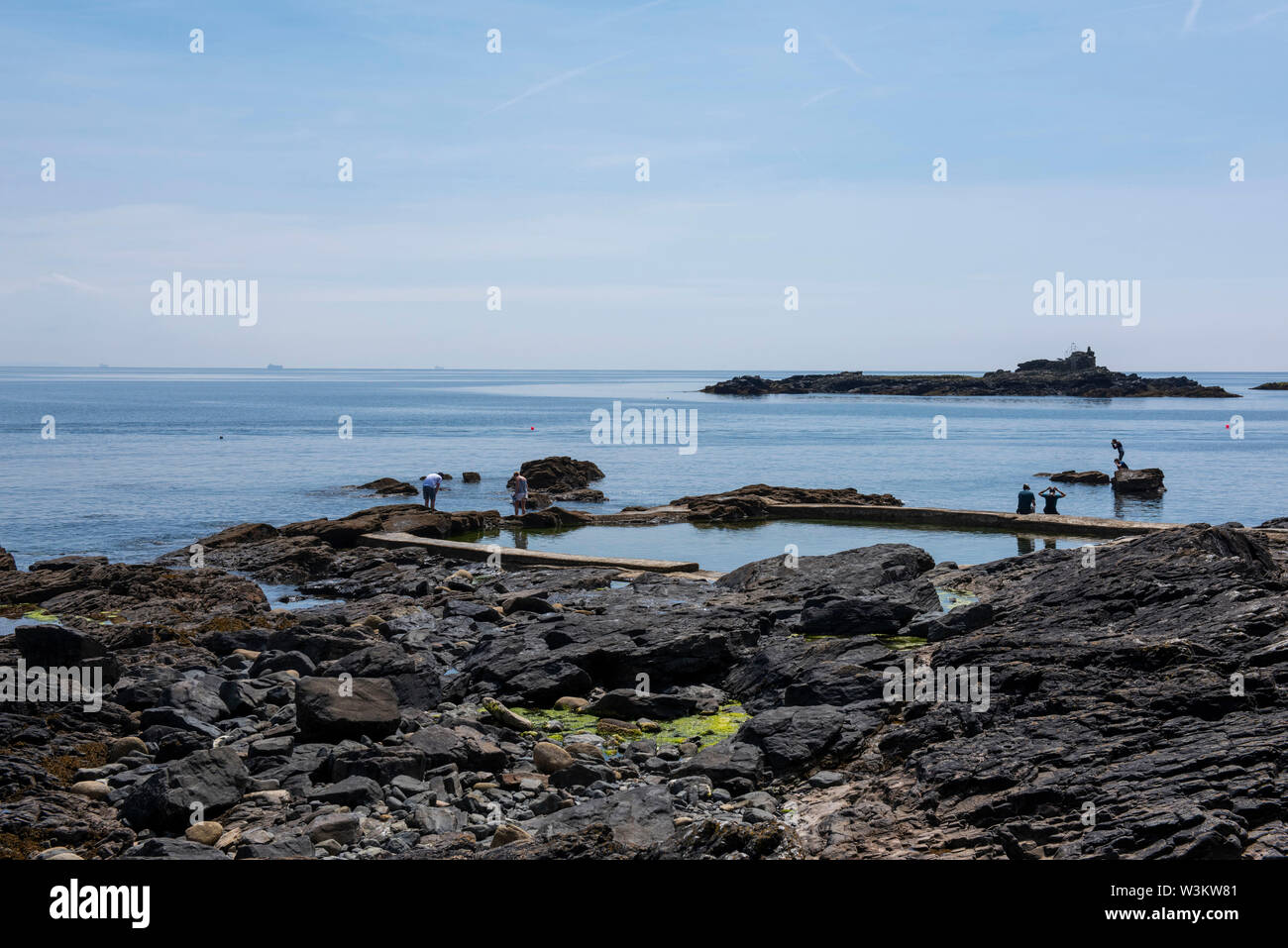 A sunny summer day at the Rock Pool in Mousehole, Cornwall England UK ...