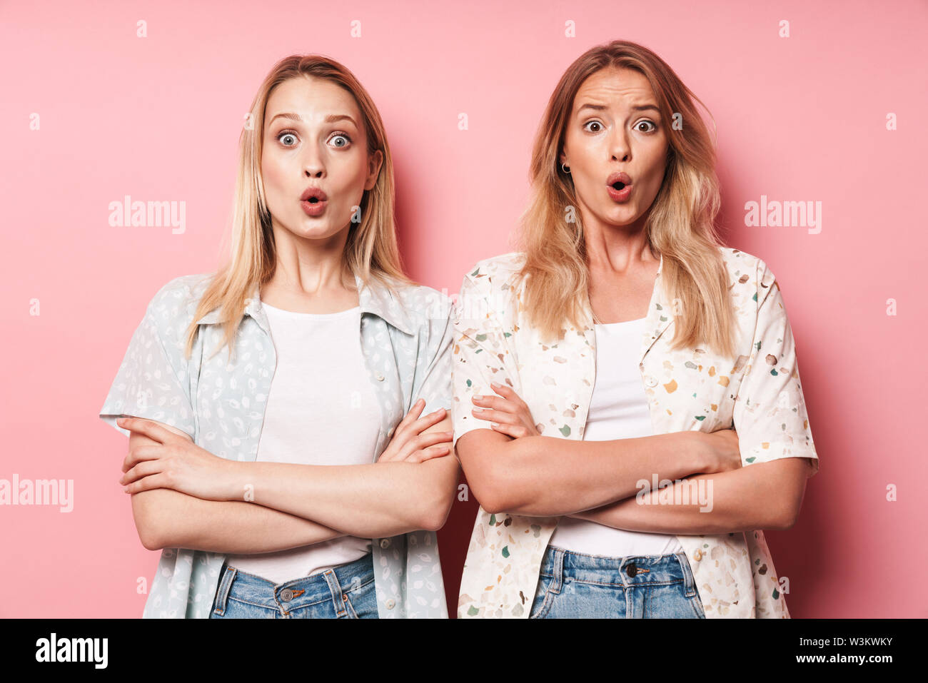 Photo of surprised shocked pretty blondes women friends posing isolated ...