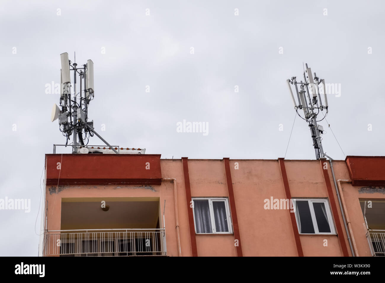 Cell tower on the roof of the building. Telecommunications equipment ...