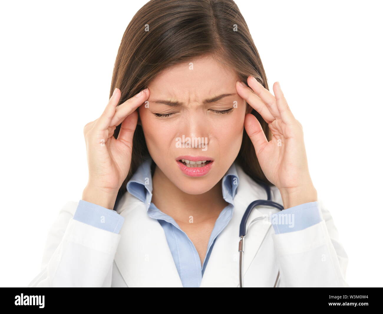 Doctor with headache stressed. Nurse / doctor with migraine headache ...