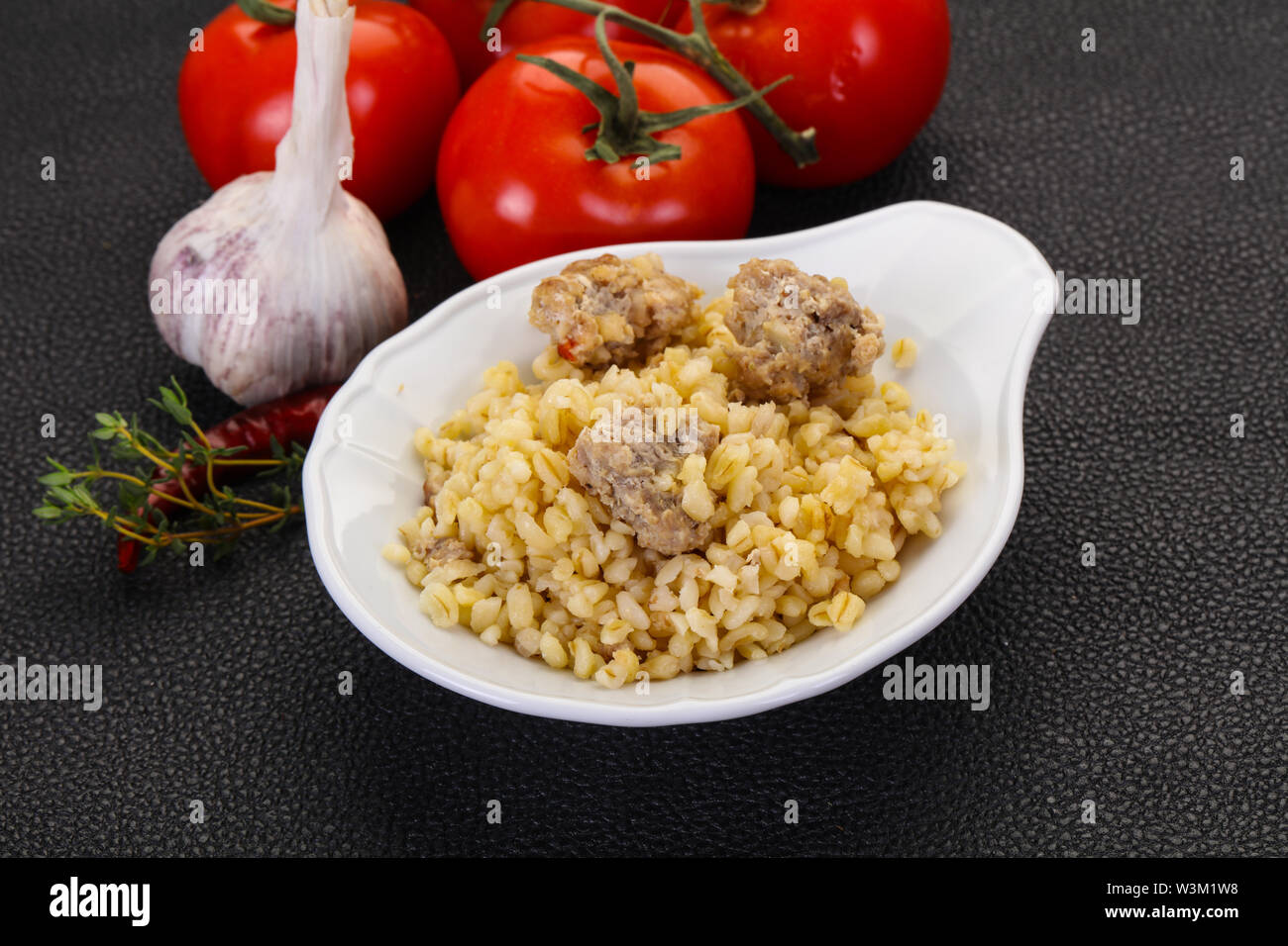 Bulgur with meat and spices Stock Photo - Alamy