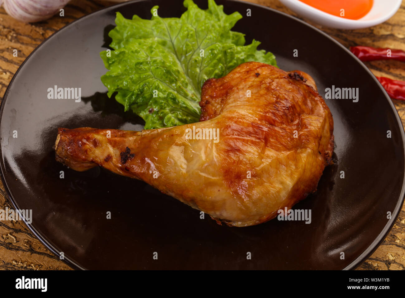 Crispy tasty Roasted chicken leg Stock Photo - Alamy