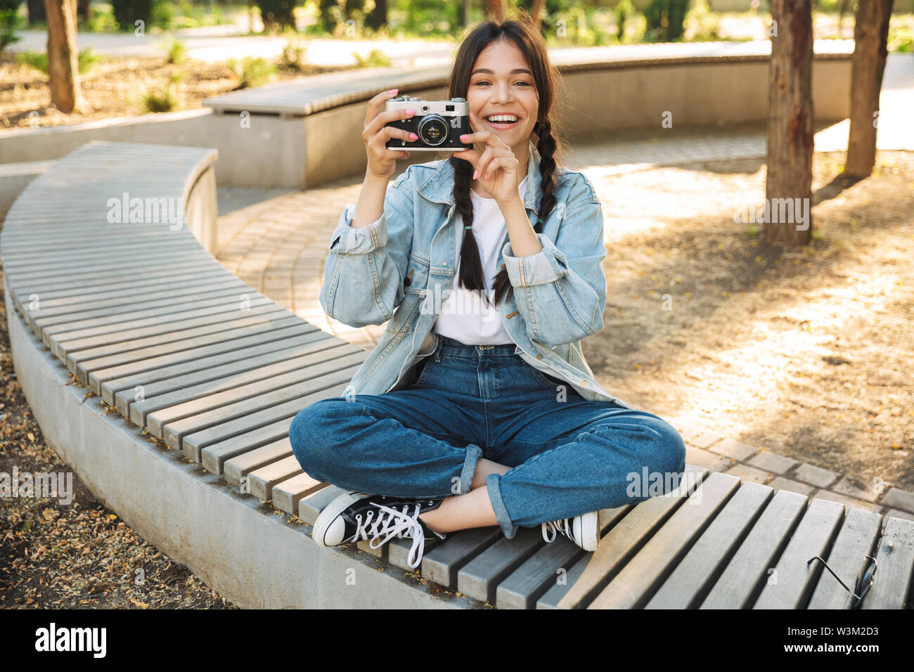 Photo of a pleased optimistic cheerful happy cute young student girl ...