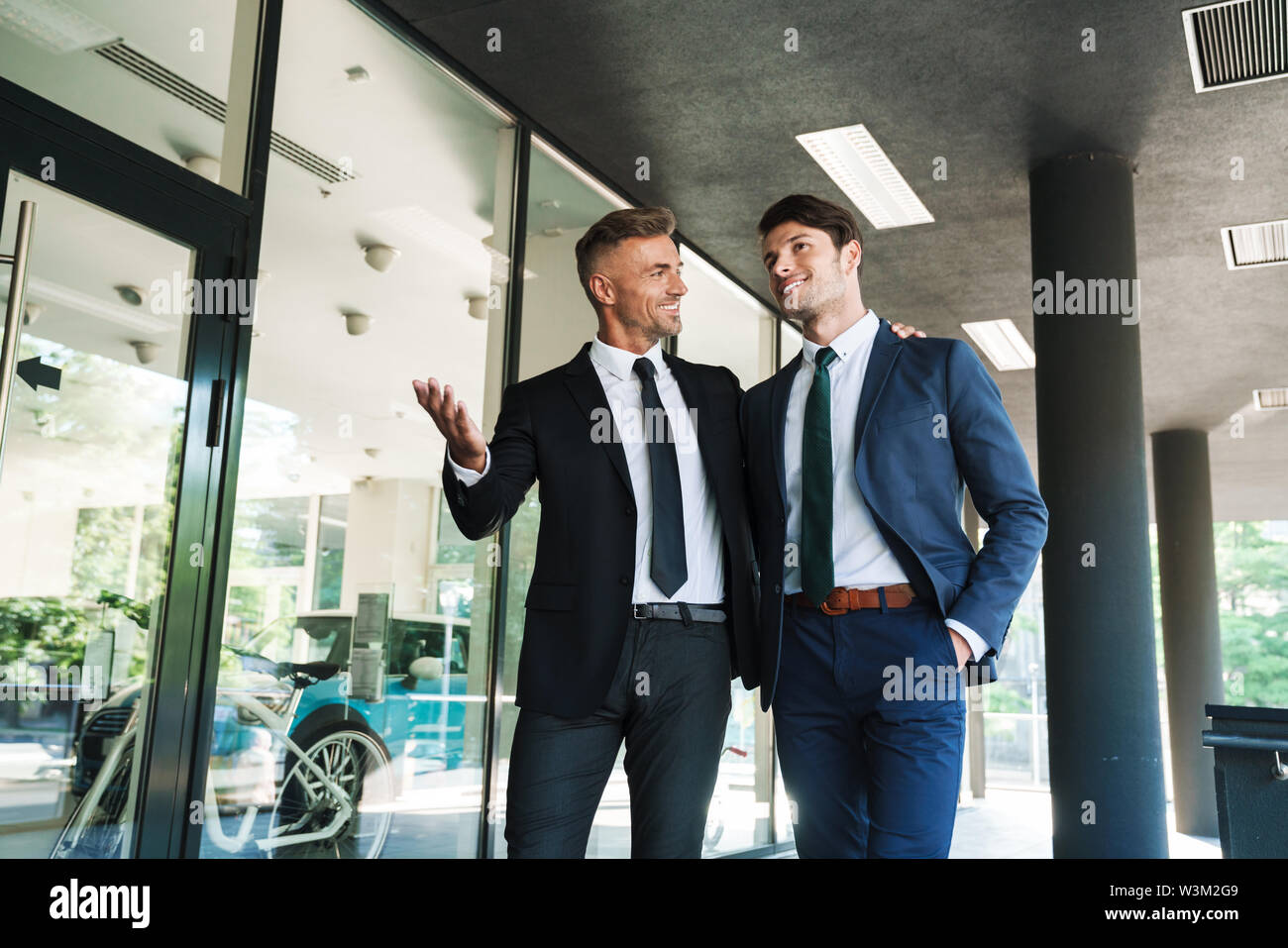 Portrait happy company two guys hi-res stock photography and images - Alamy