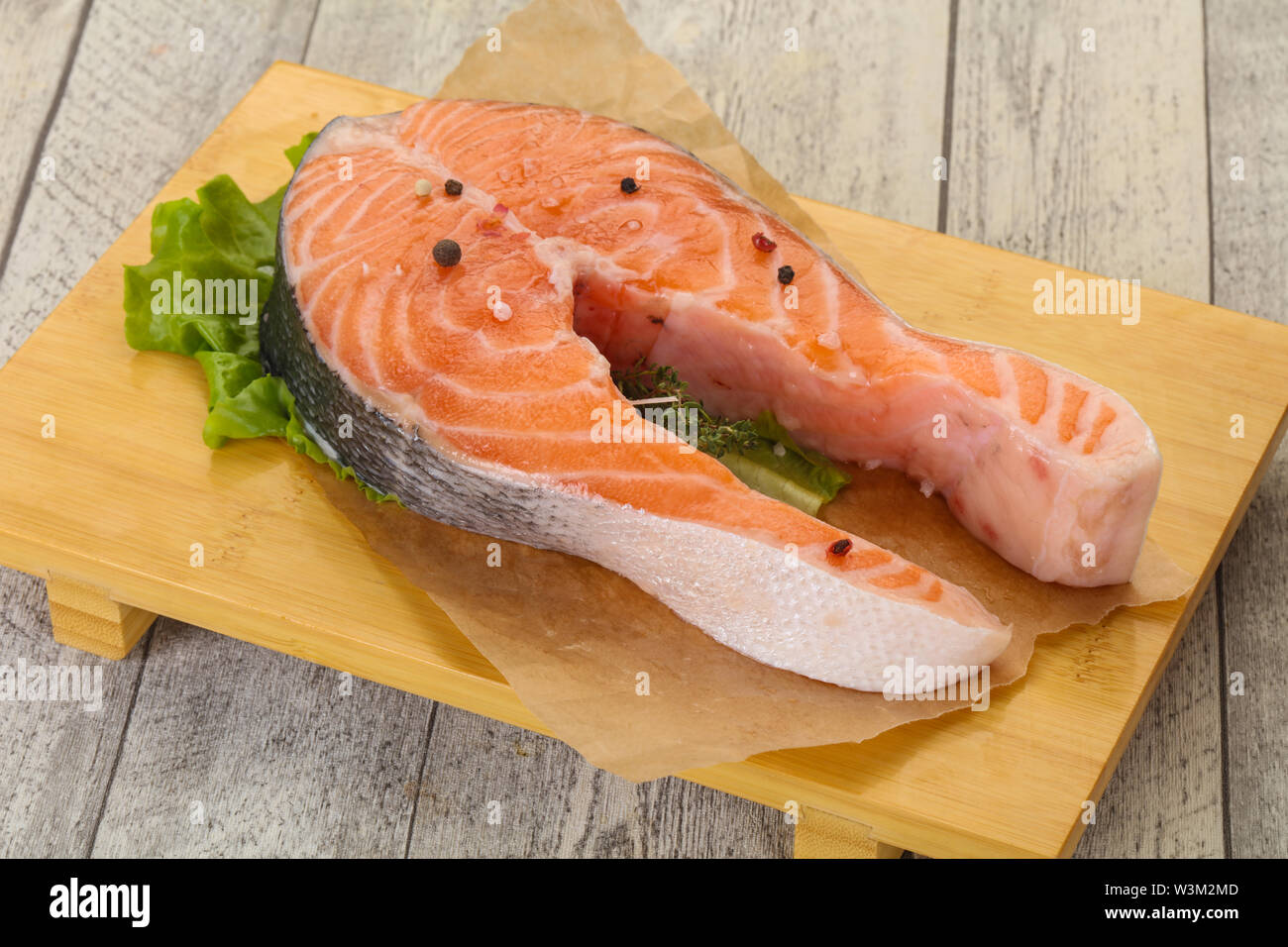Raw salmon steak with salt and pepper - ready for grill Stock Photo - Alamy
