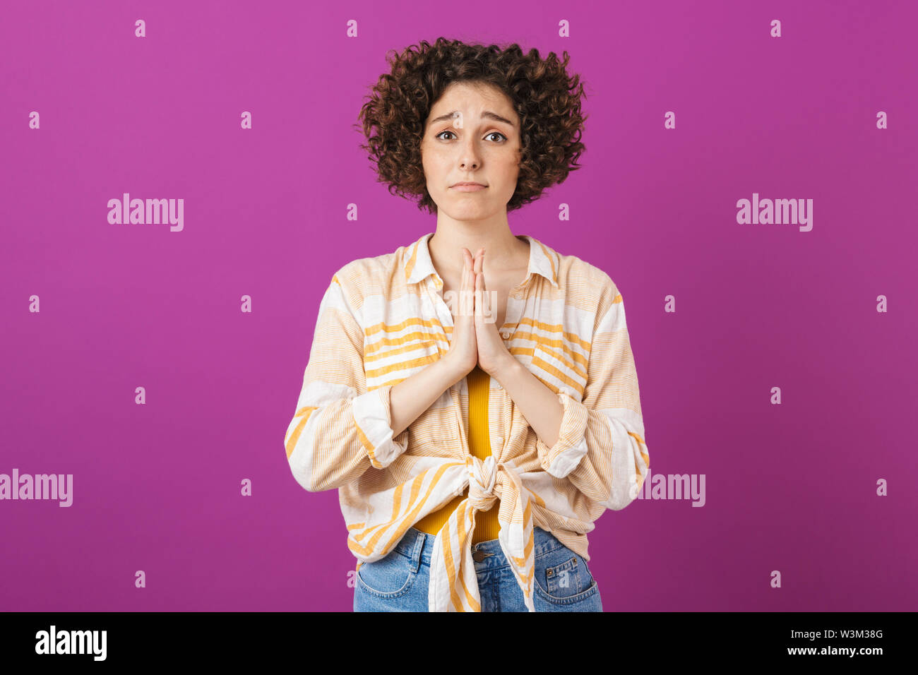 Pretty caucasian woman begging hands hi-res stock photography and ...
